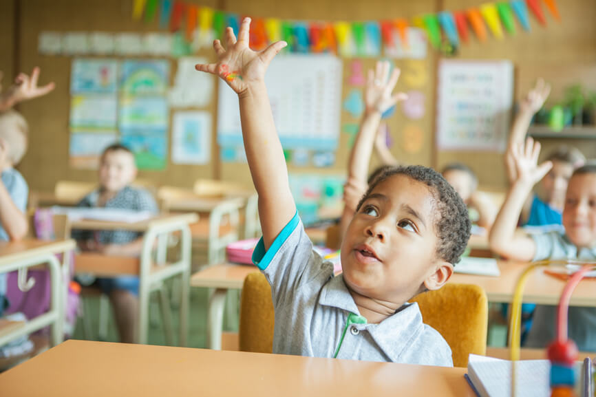 Child raising hand in class Kid Matters Counseling Child raising hand in class Kid Matters Counseling